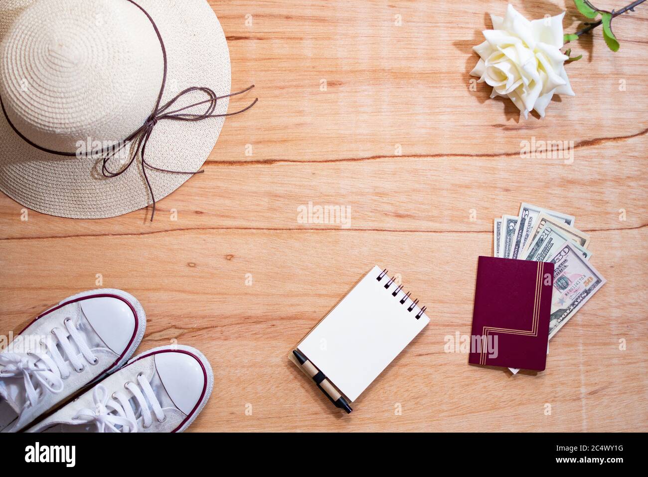 wooden background with hat, converse, notebook and passport Stock Photo ...