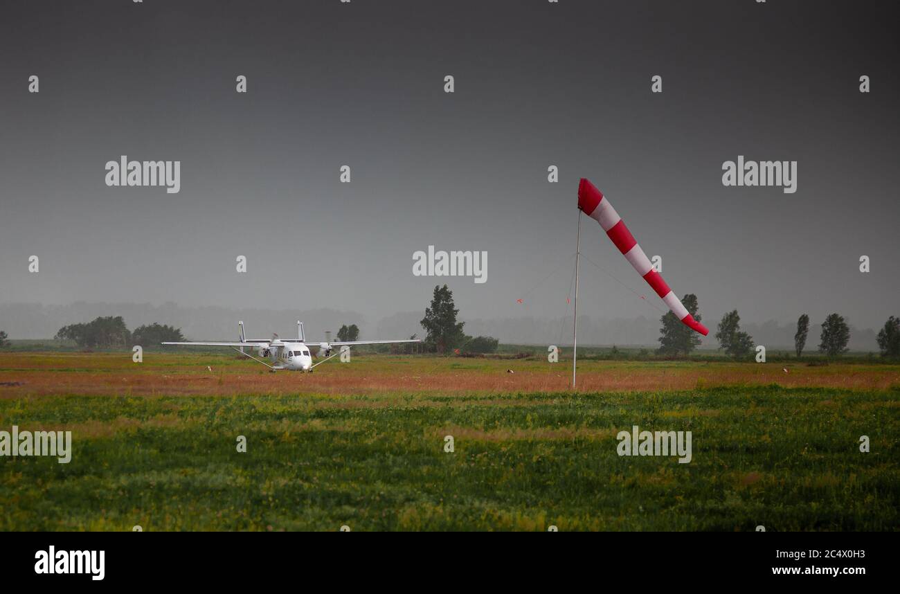 Windsock, weather vane for airfields. Red and white striped fabric ...