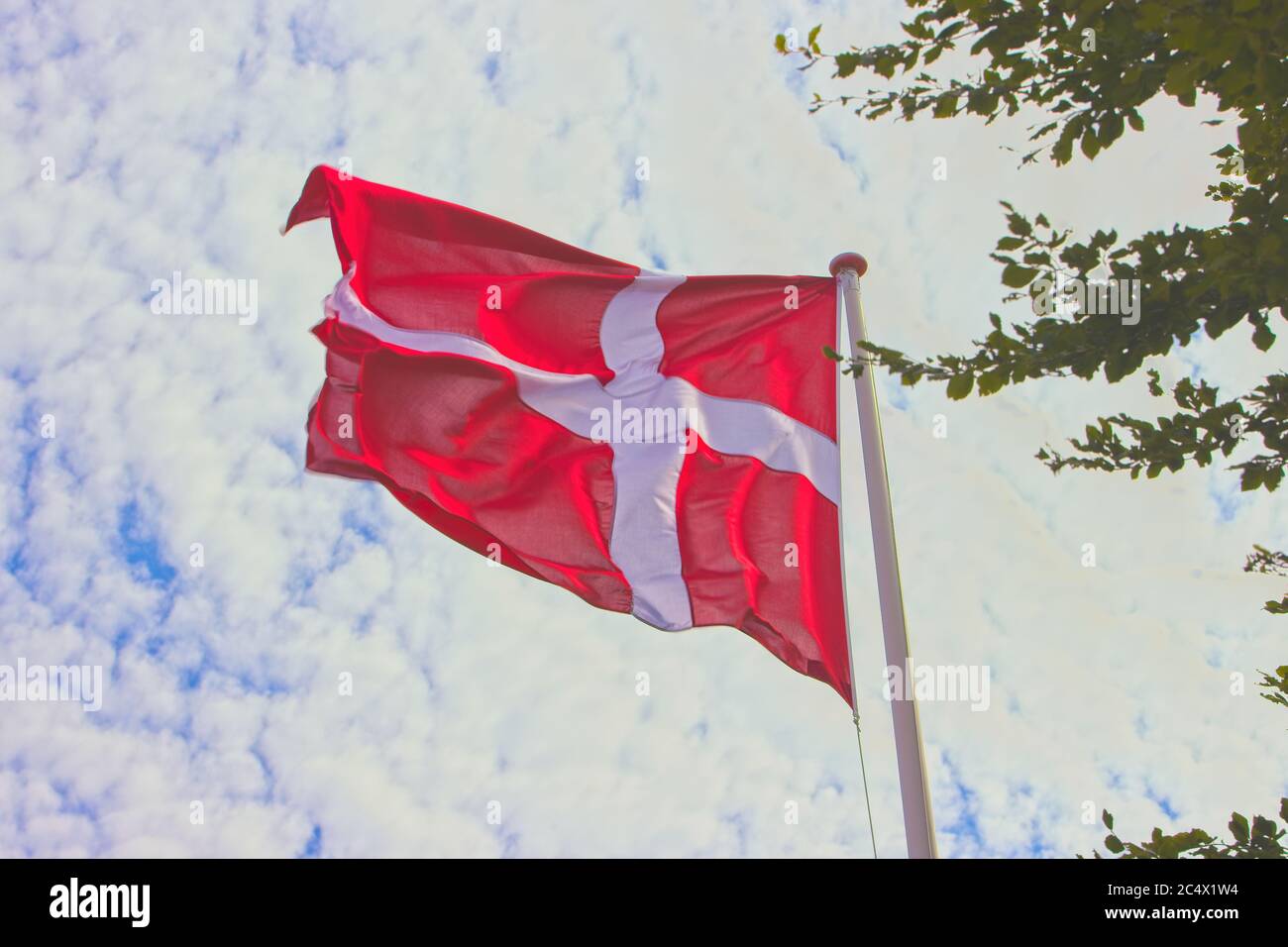 The Danish flag stands proud in the wind Stock Photo - Alamy