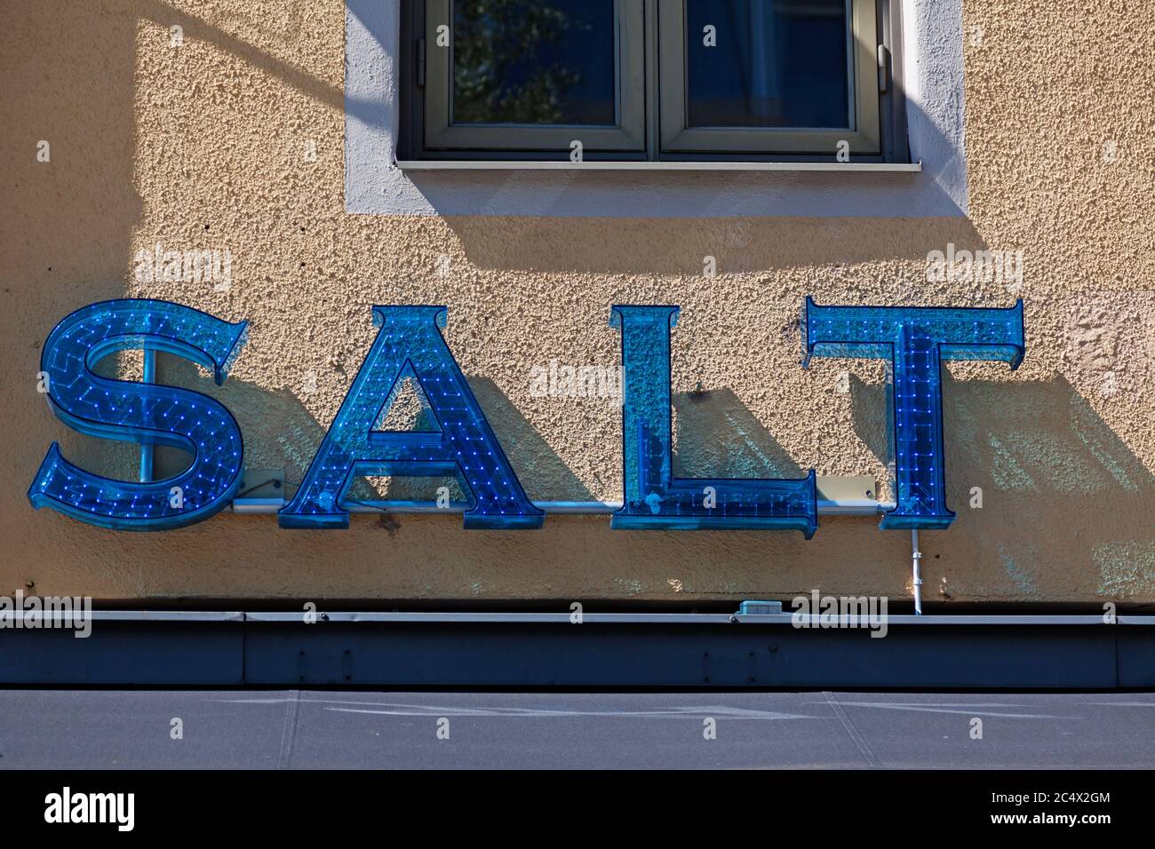 a blue diode sign under a window where it says salt Stock Photo - Alamy