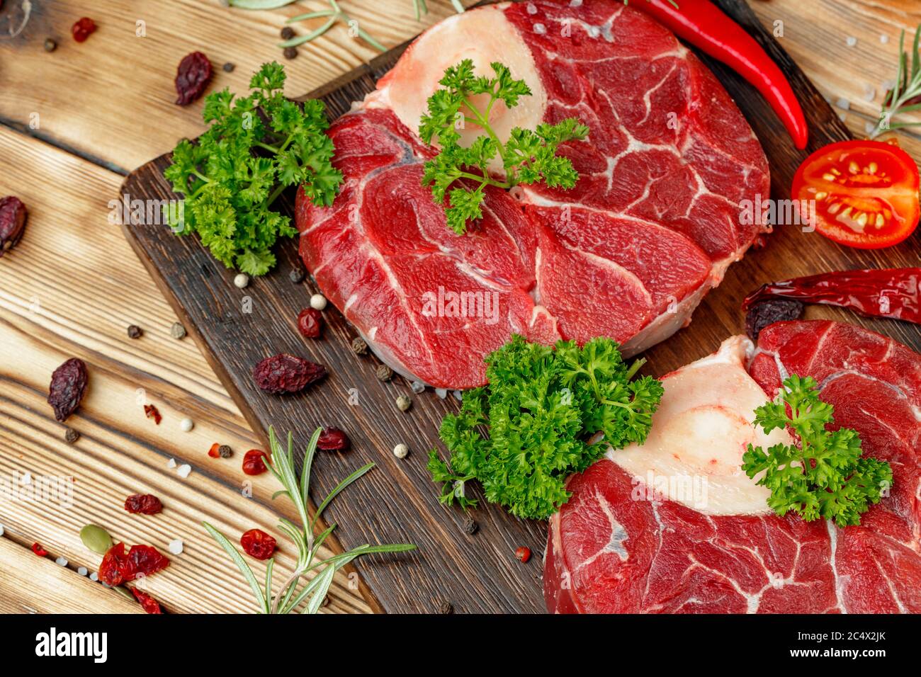 Raw meat slice for grill with seasoning Stock Photo - Alamy