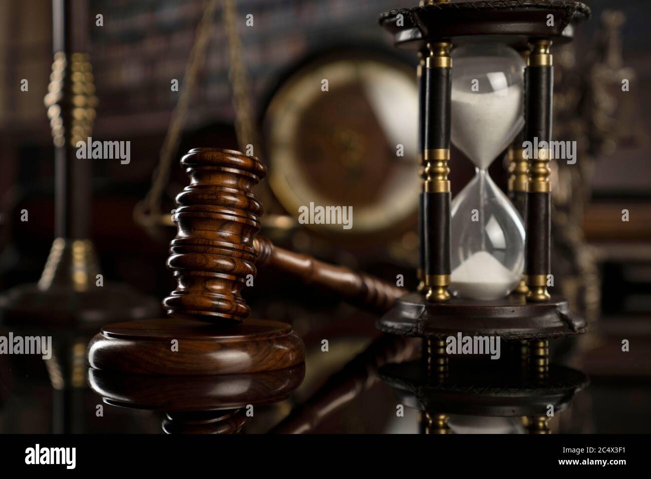 Law theme. Court library. Gavel, scale and Themis statue on brown ...