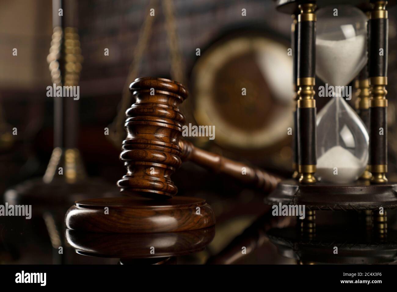 Law theme. Court library. Gavel, scale and Themis statue on brown ...