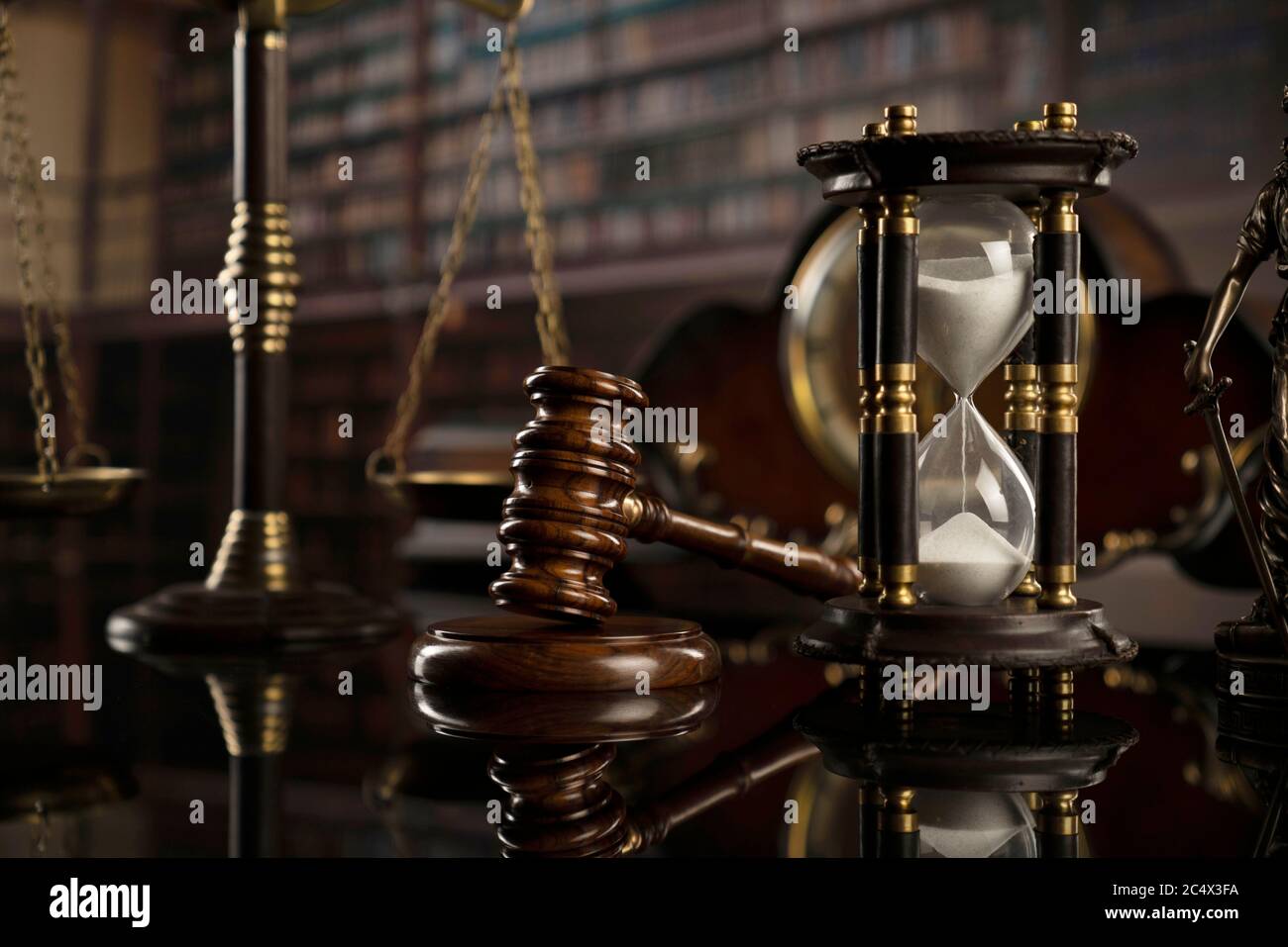 Law theme. Court library. Gavel, scale and Themis statue on brown ...