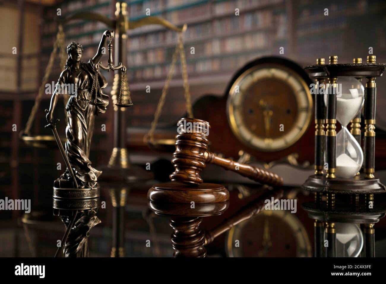 Law theme. Court library. Gavel, scale and Themis statue on brown ...