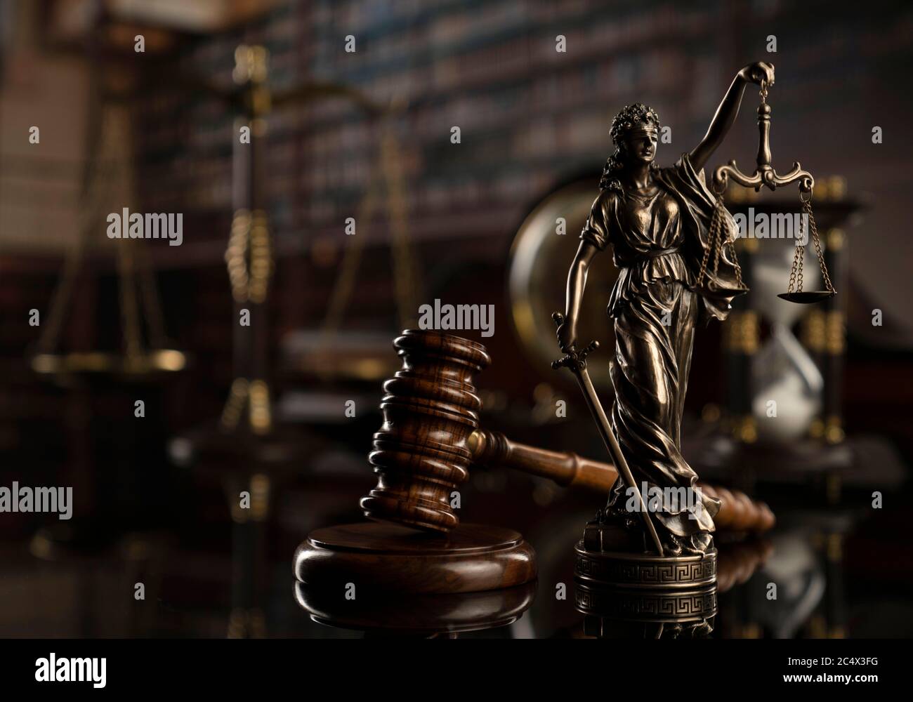 Law theme. Court library. Gavel, scale and Themis statue on brown ...