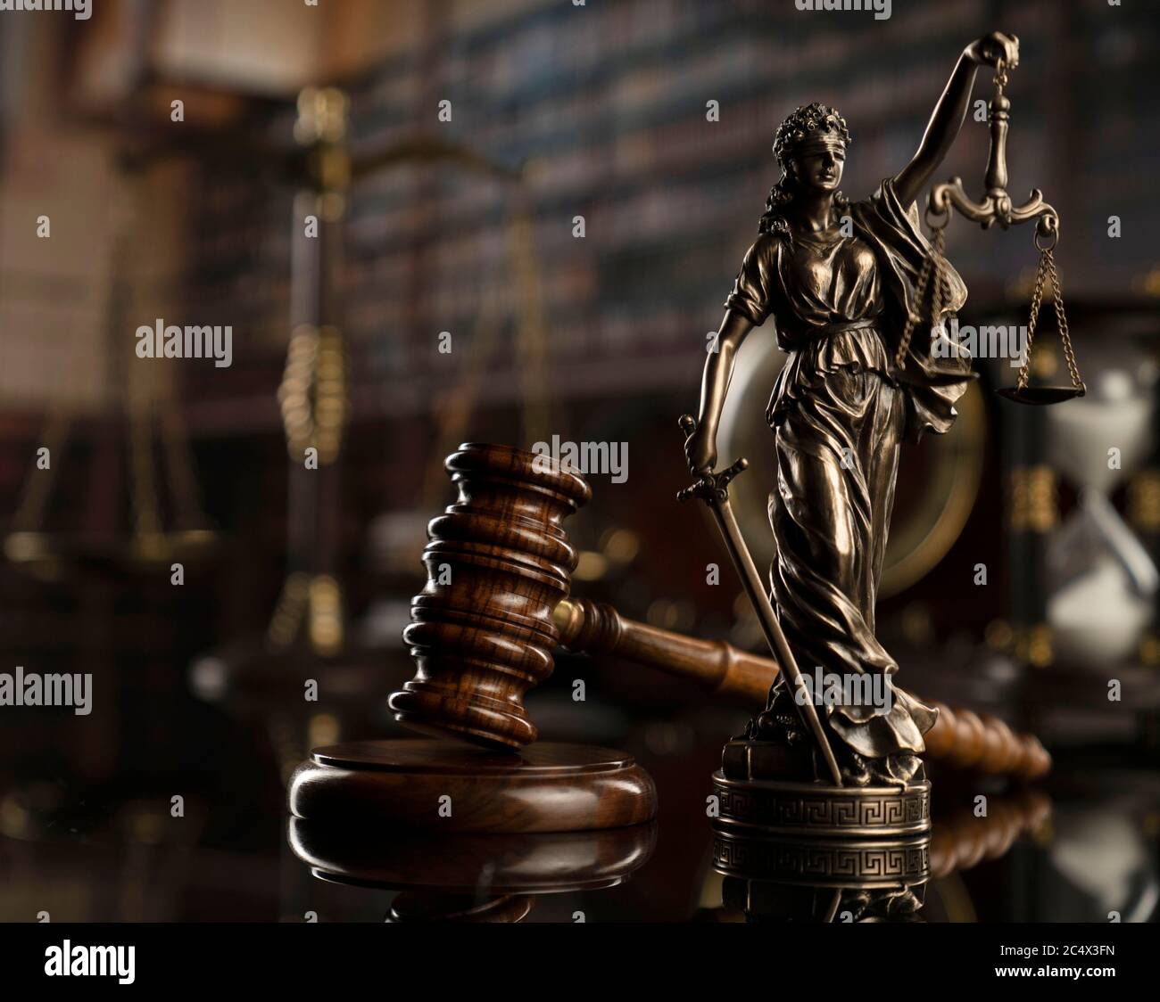 Law theme. Court library. Gavel, scale and Themis statue on brown ...