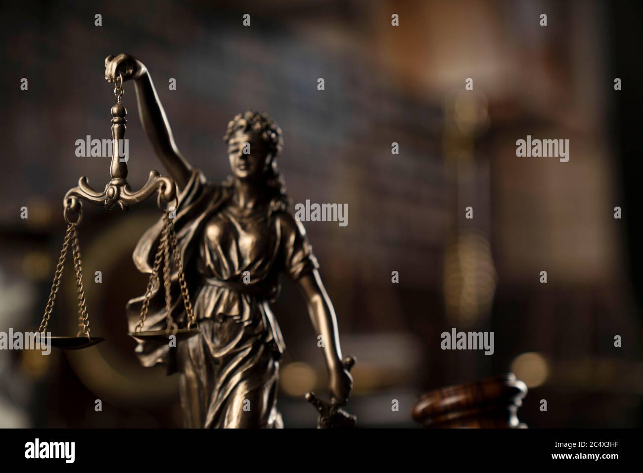 Law theme. Court library. Gavel, scale and Themis statue on brown ...