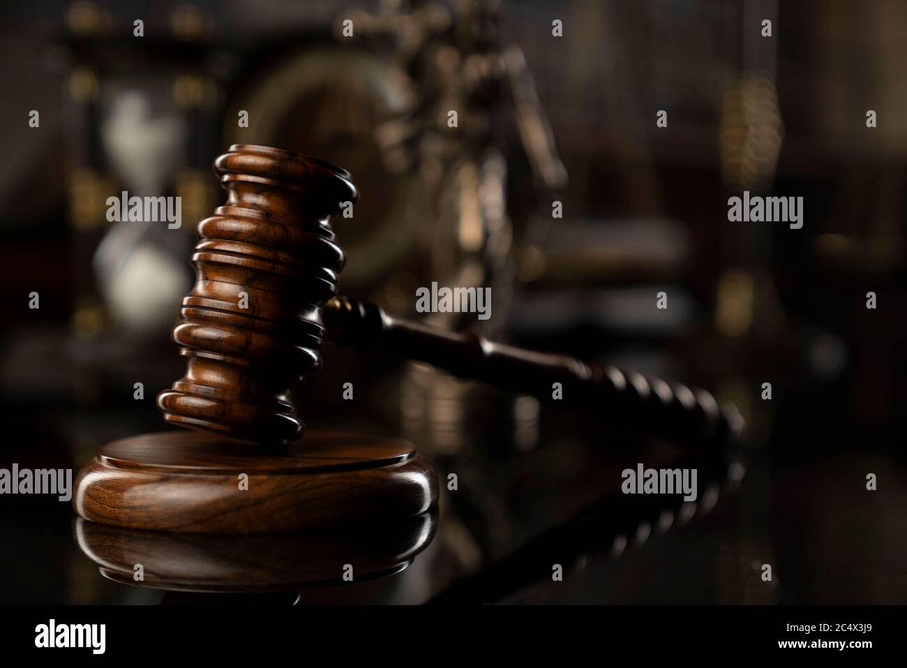 Law theme. Court library. Gavel, scale and Themis statue on brown ...