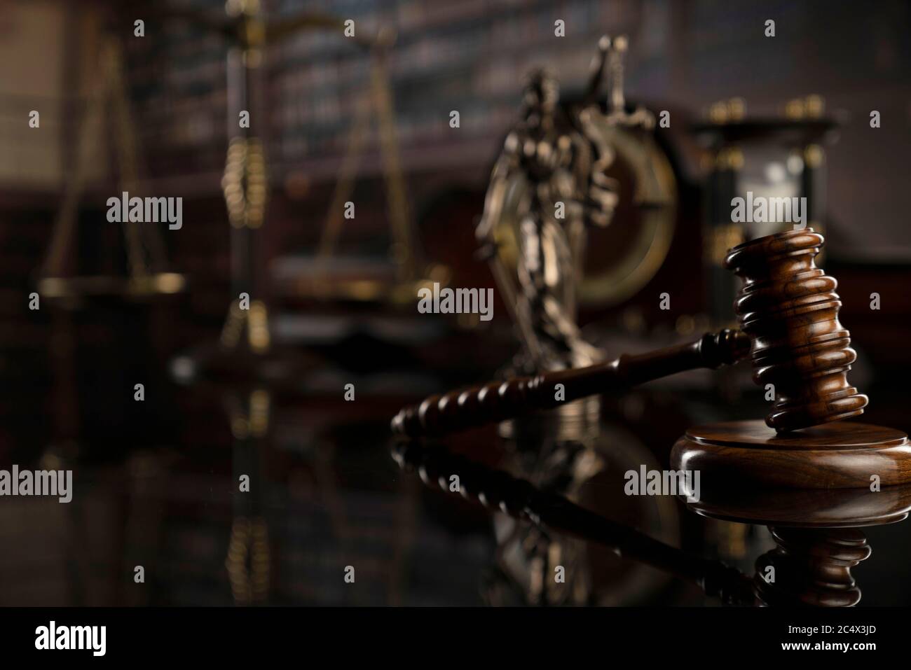 Law theme. Court library. Gavel, scale and Themis statue on brown ...