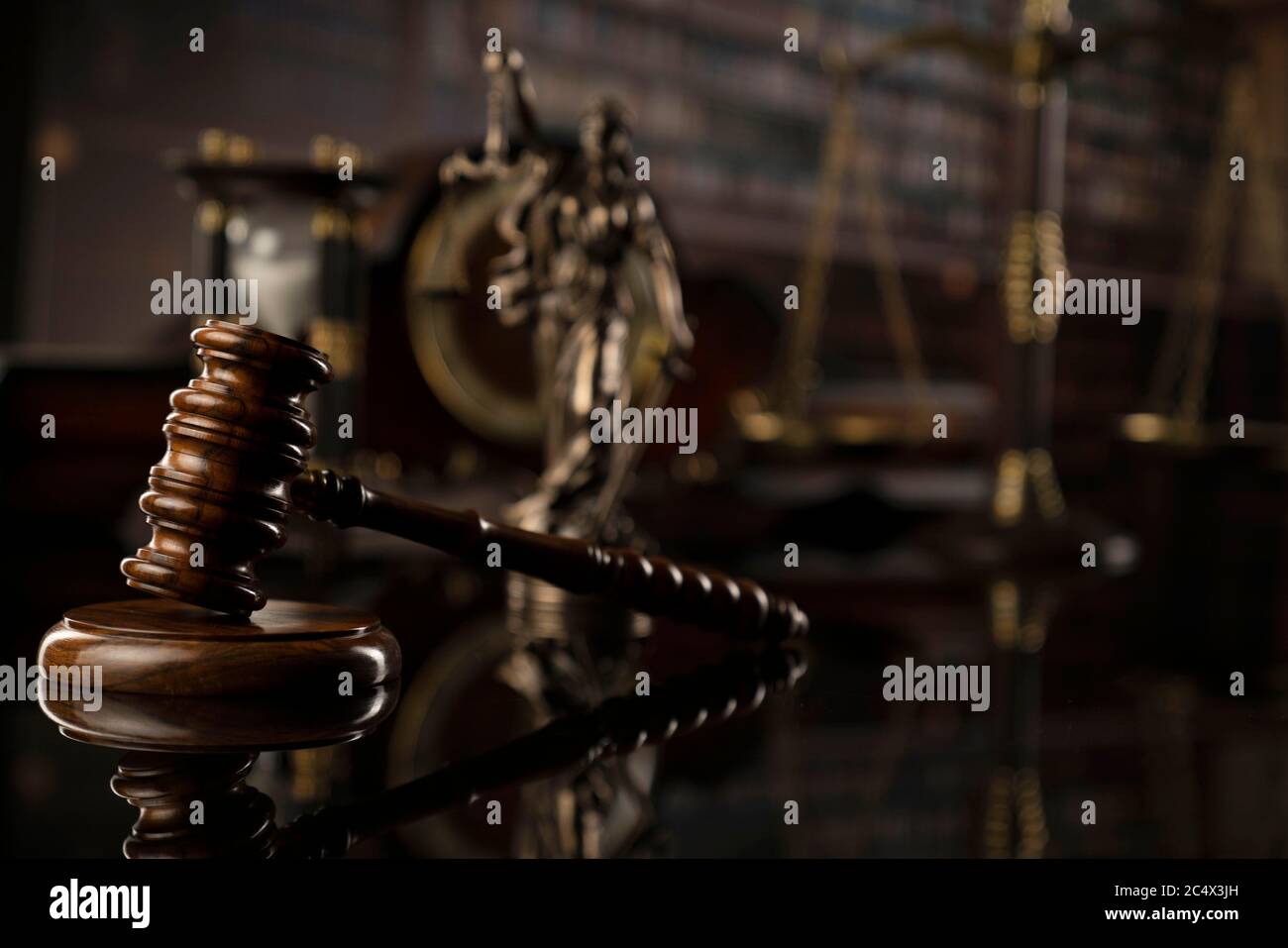 Law theme. Court library. Gavel, scale and Themis statue on brown ...