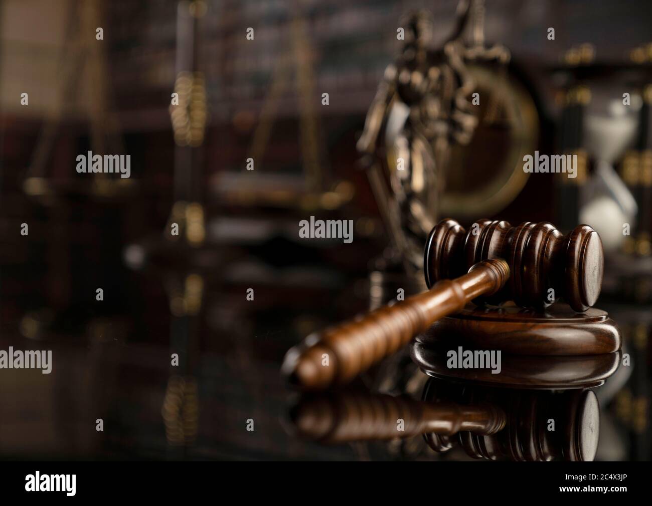 Law theme. Court library. Gavel, scale and Themis statue on brown ...