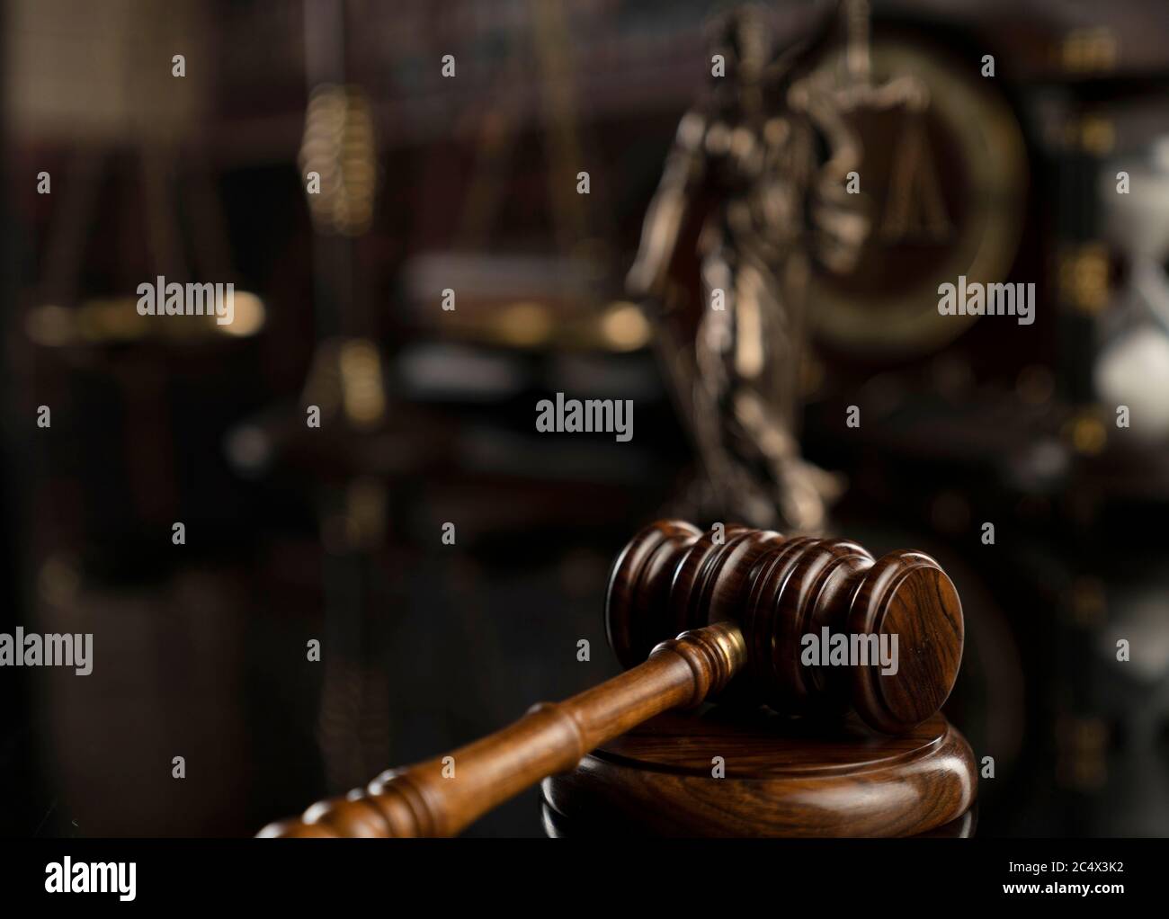 Law theme. Court library. Gavel, scale and Themis statue on brown ...