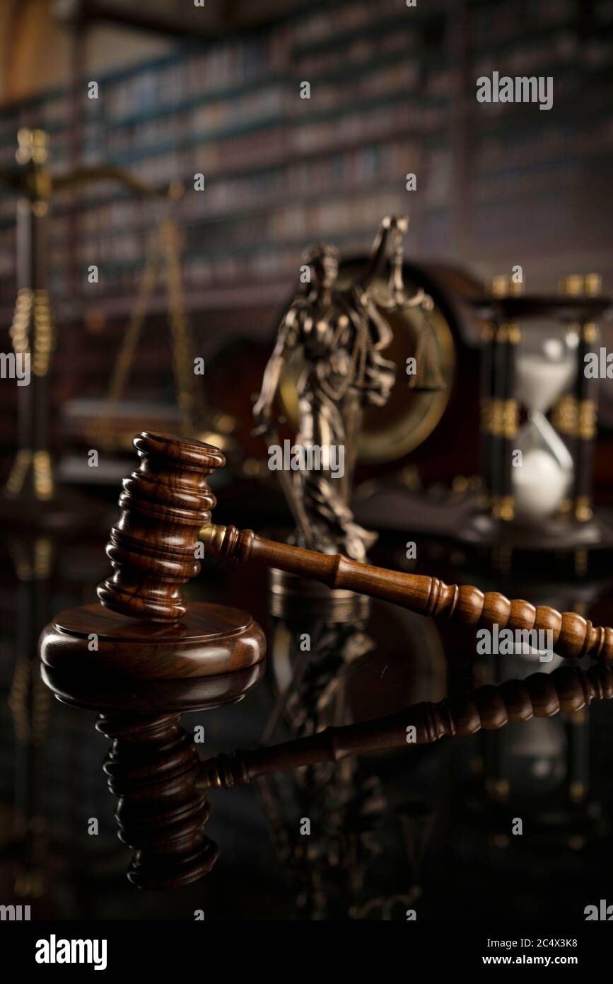 Law theme. Court library. Gavel, scale and Themis statue on brown ...