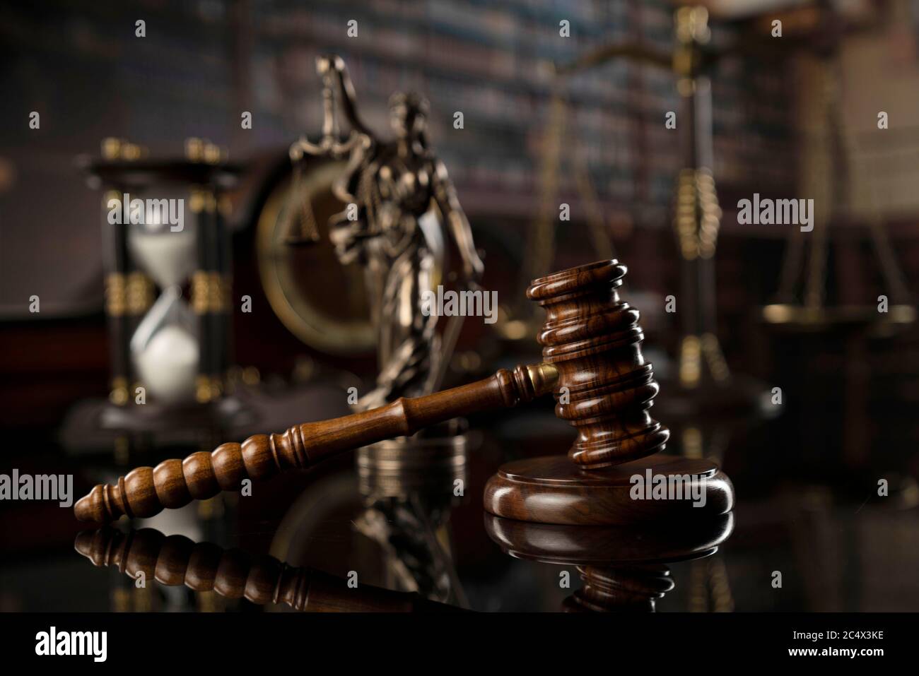 Law theme. Court library. Gavel, scale and Themis statue on brown ...