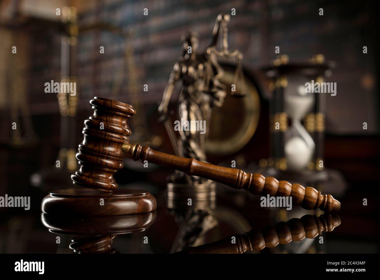 Law theme. Court library. Gavel, scale and Themis statue on brown ...