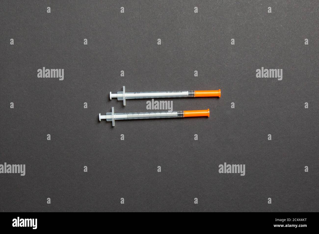 Top view of insulin syringes ready for injection on colorful background ...
