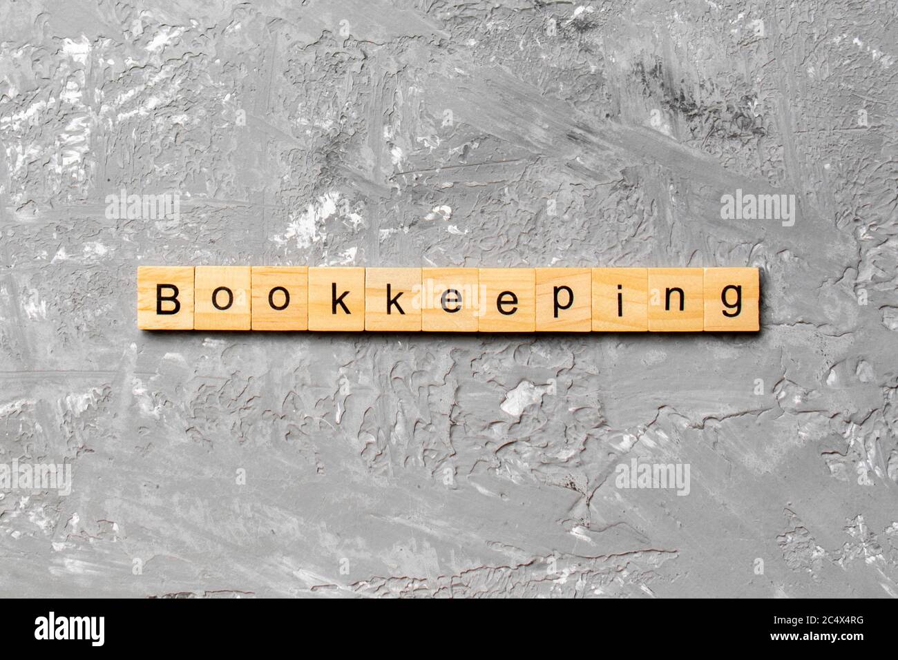 bookkeeping word written on wood block. bookkeeping text on table ...