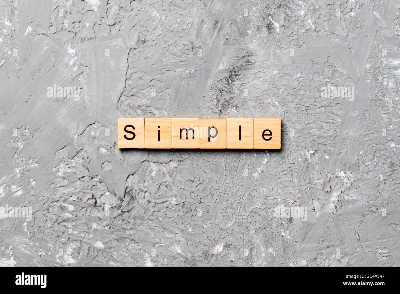 simple word written on wood block. simple text on table, concept Stock ...