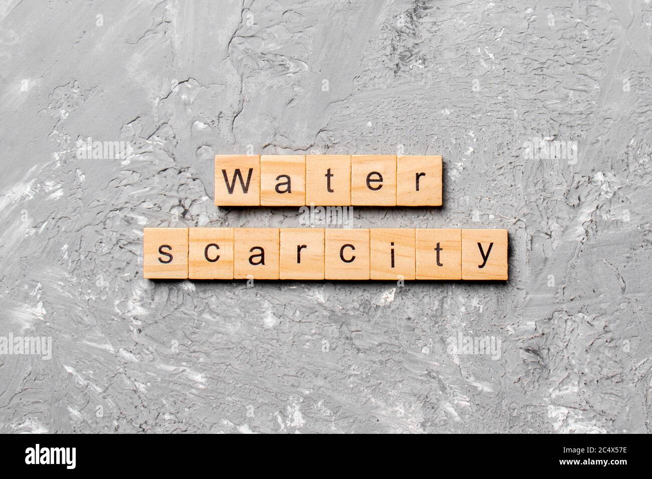 Water scarcity word written on wood block. Water scarcity text on ...