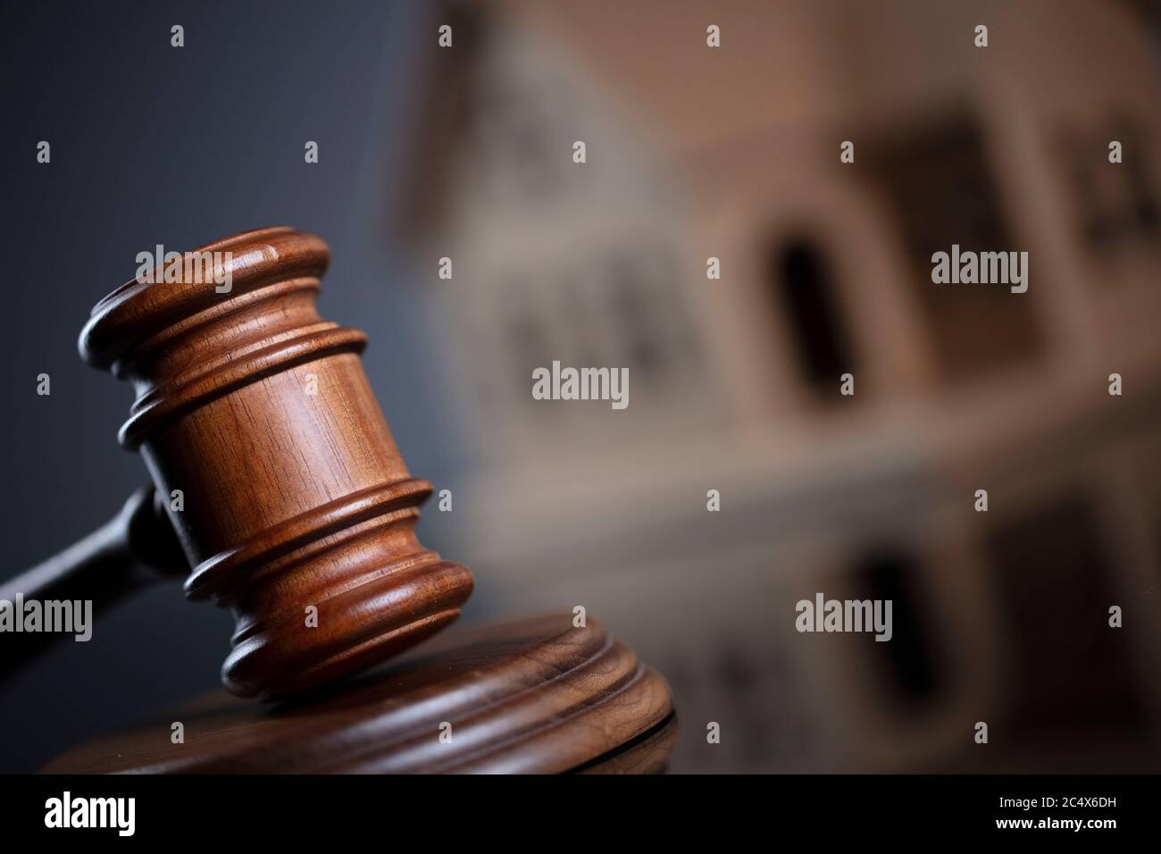 Law theme. Construction law's symbols - yellow helmet, house model and ...