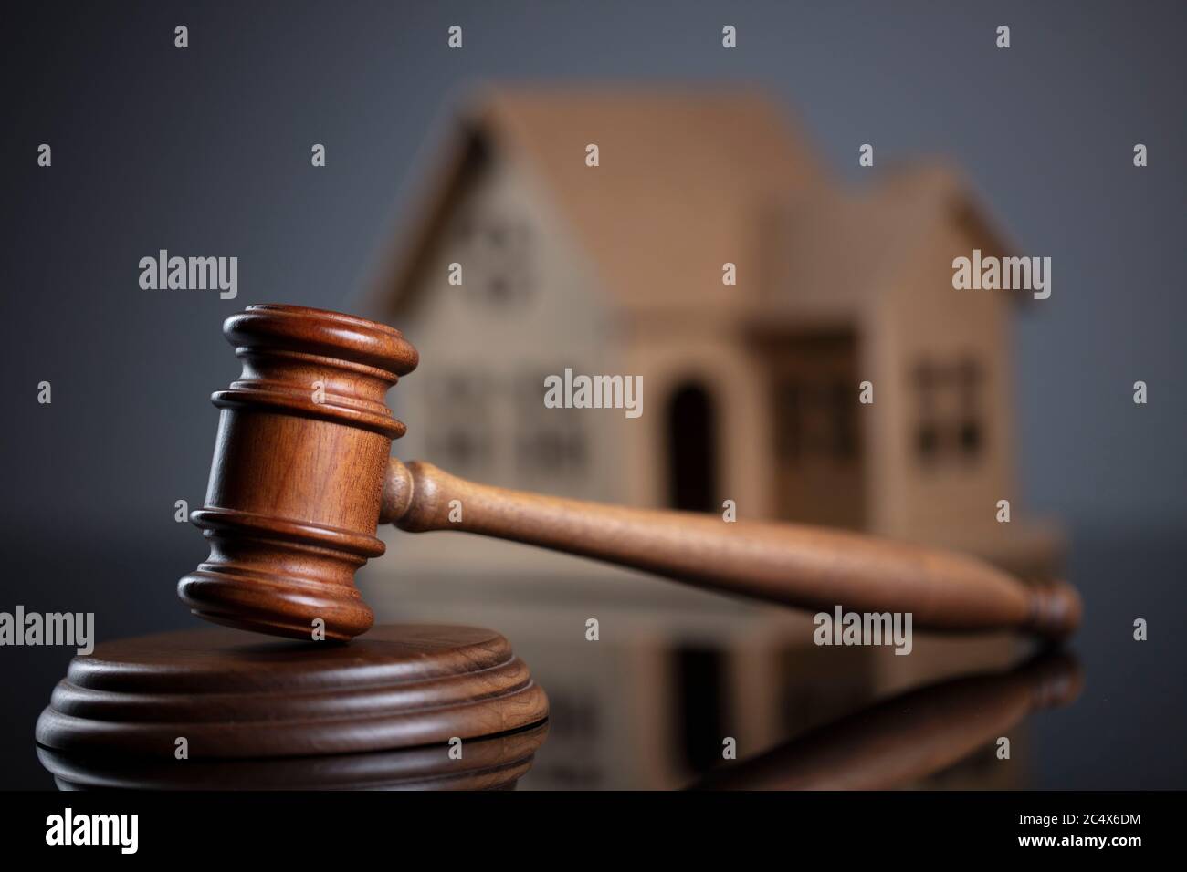 Law theme. Construction law's symbols - yellow helmet, house model and ...