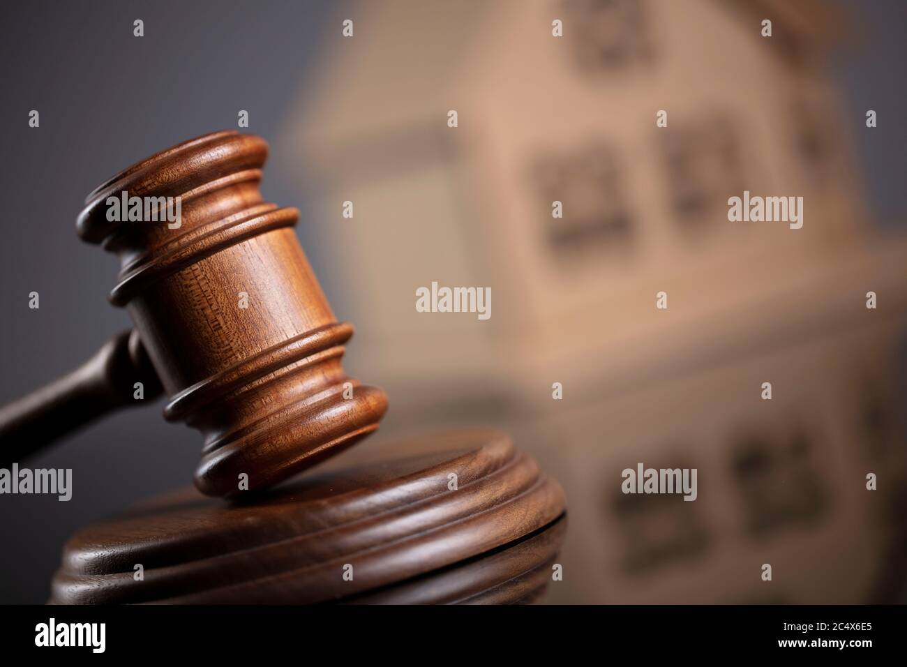 Law theme. Construction law's symbols - yellow helmet, house model and ...