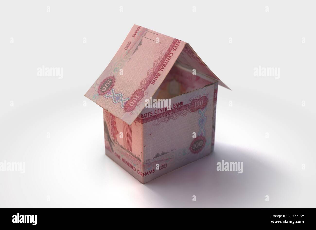 A concept of UAE dirham bank notes folded into the shape of a simple ...
