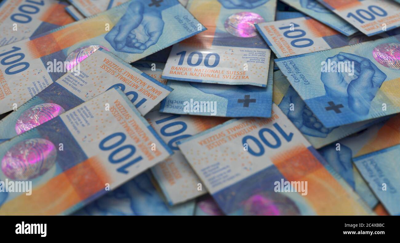 A close-up view of a scattered pile of swiss franc banknotes - 3D ...
