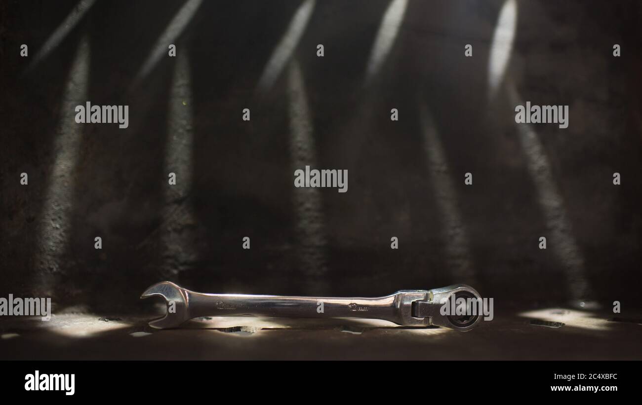 Gear key on steel background with smoke Stock Photo - Alamy