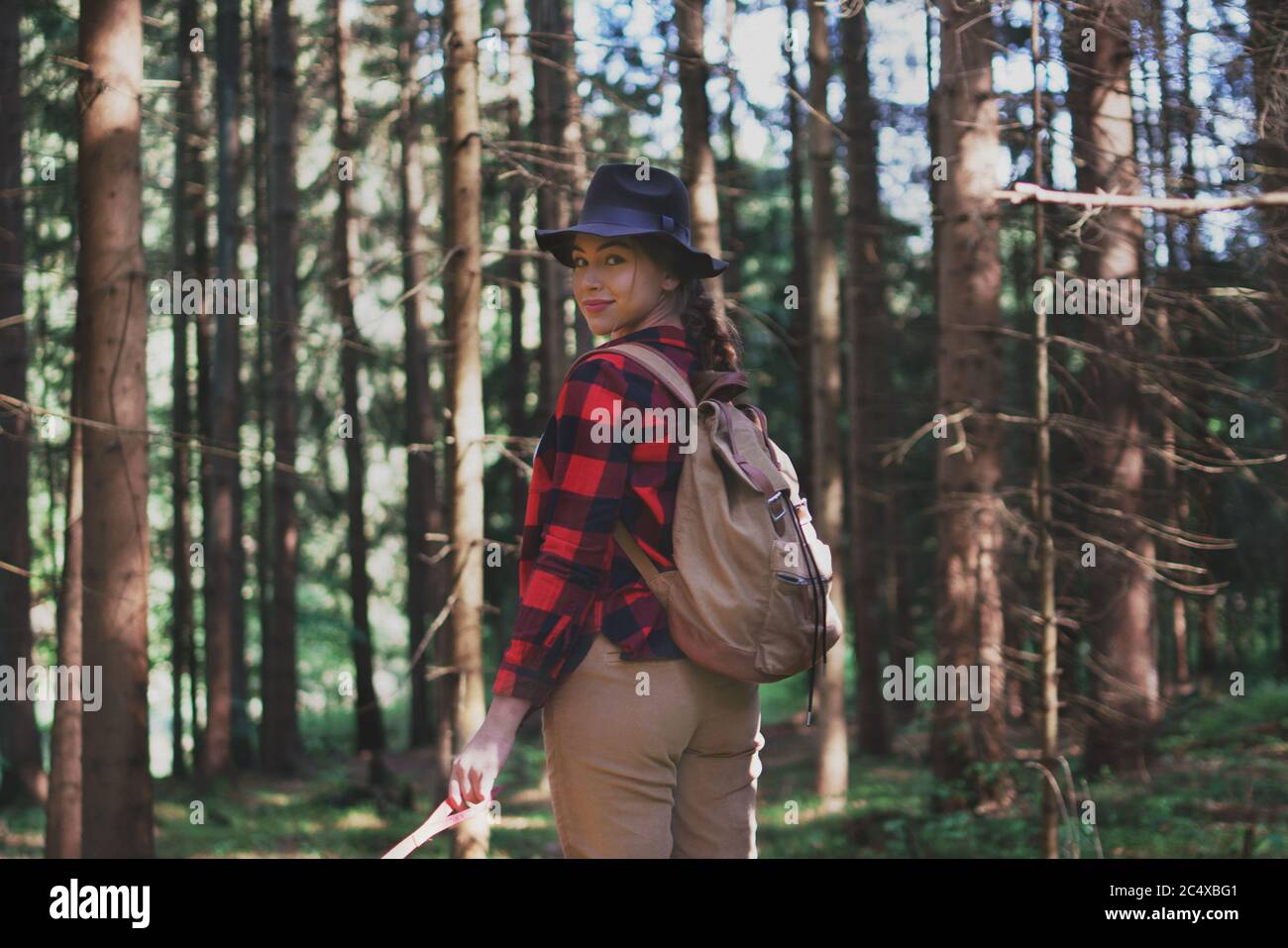 Young woman on a walk outdoors in forest in summer nature Stock Photo ...