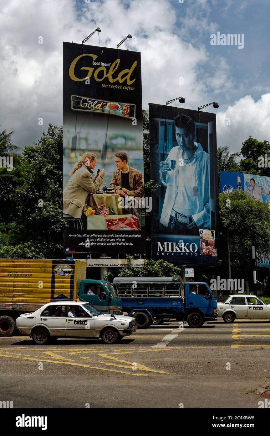 Advertising billboards hoardings at a busy box junction in Yangon ...