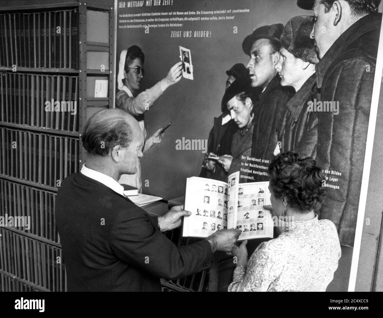 A staff member of the German Red Cross shows the search tape of the ...