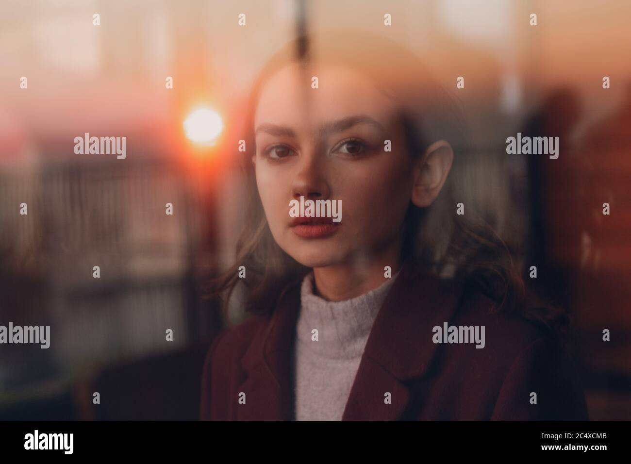 Beautiful young teenager girl portrait behind window glass Stock Photo ...