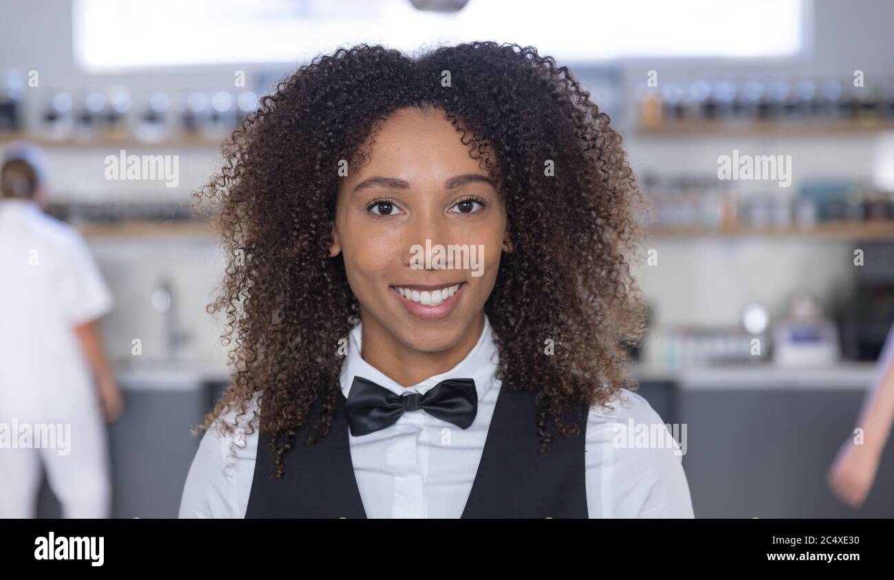 Portrait of female waitress at restaurant kitchen Stock Photo - Alamy