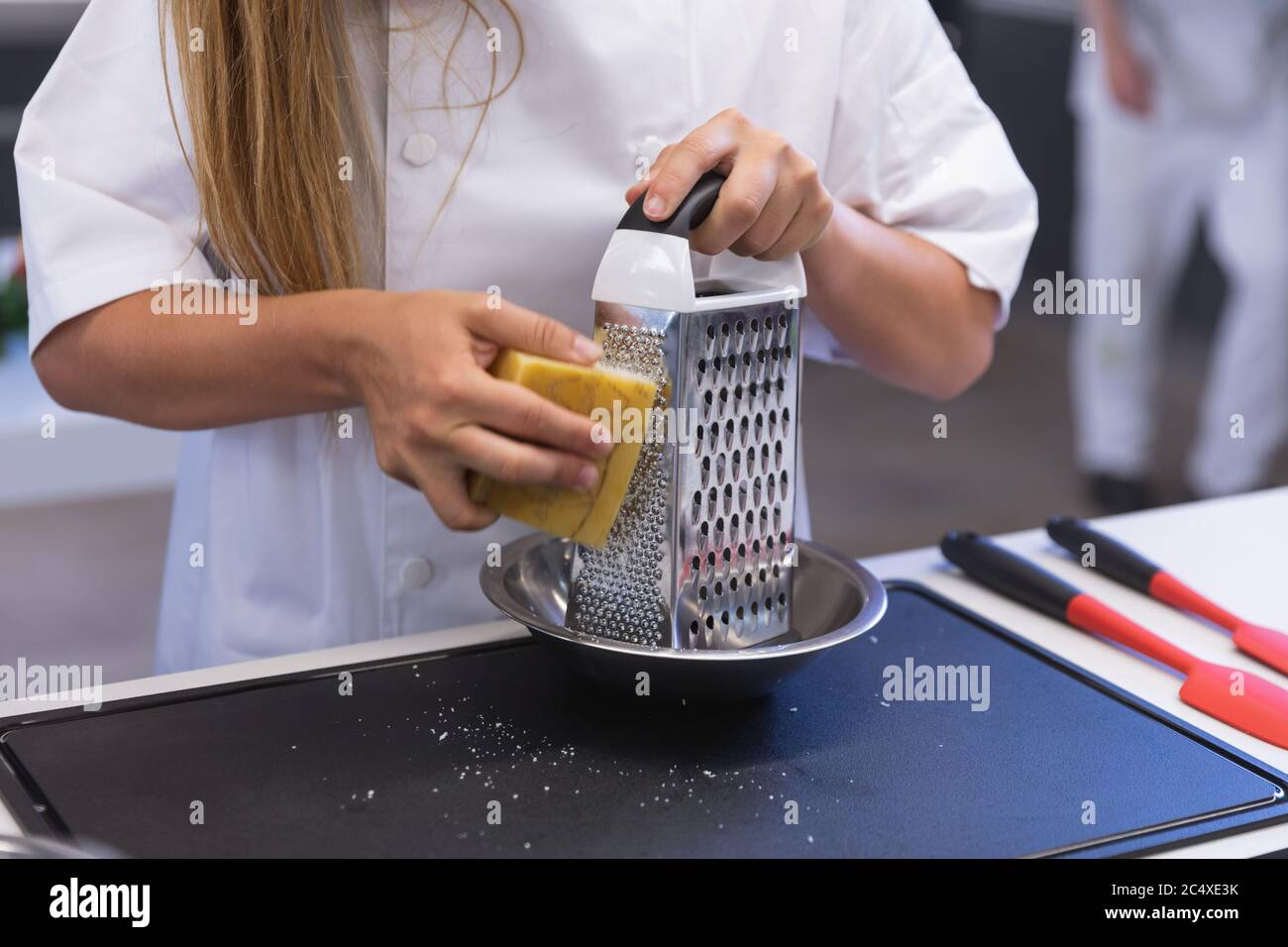 Grating cheese hi-res stock photography and images - Alamy