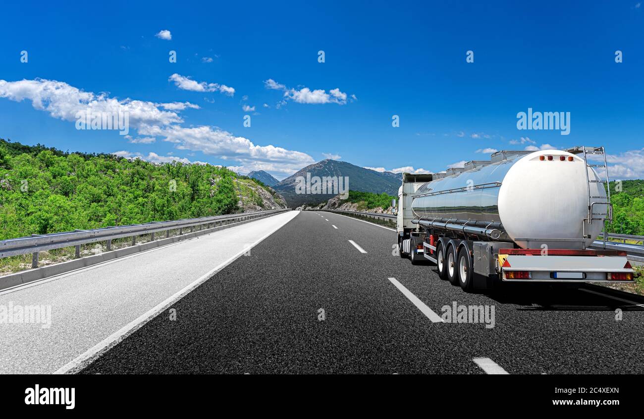 Big fuel gas tanker truck on highway Stock Photo - Alamy