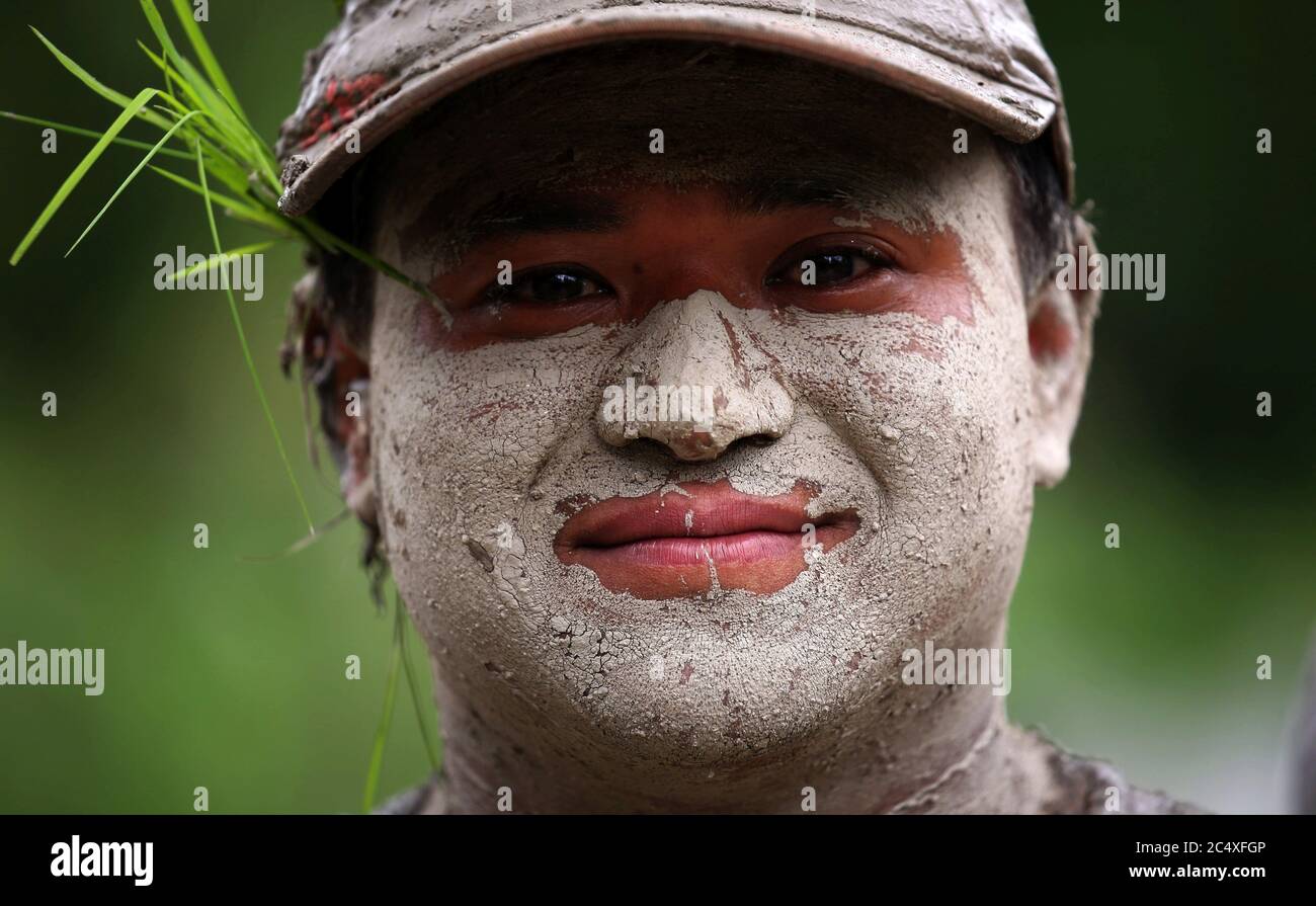 Kathmandu, Nepal. 29th June, 2020. A Nepali man face covered with mud ...