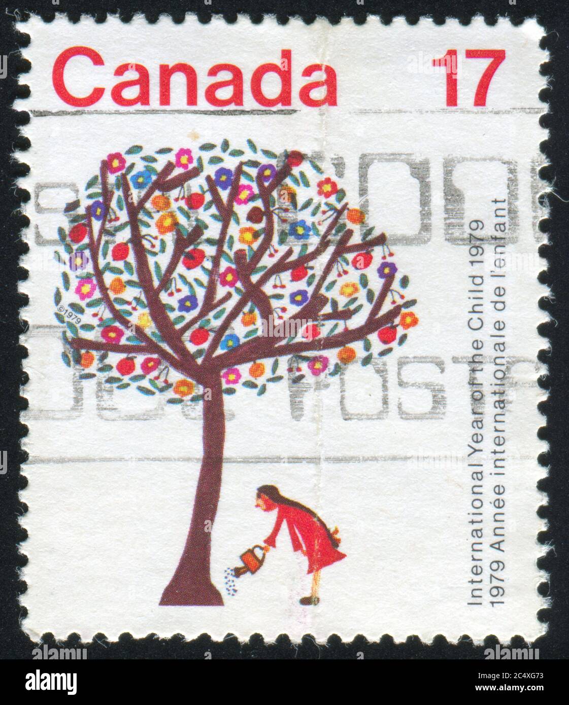 CANADA - CIRCA 1979: stamp printed by Canada, shows Girl Watering Tree ...
