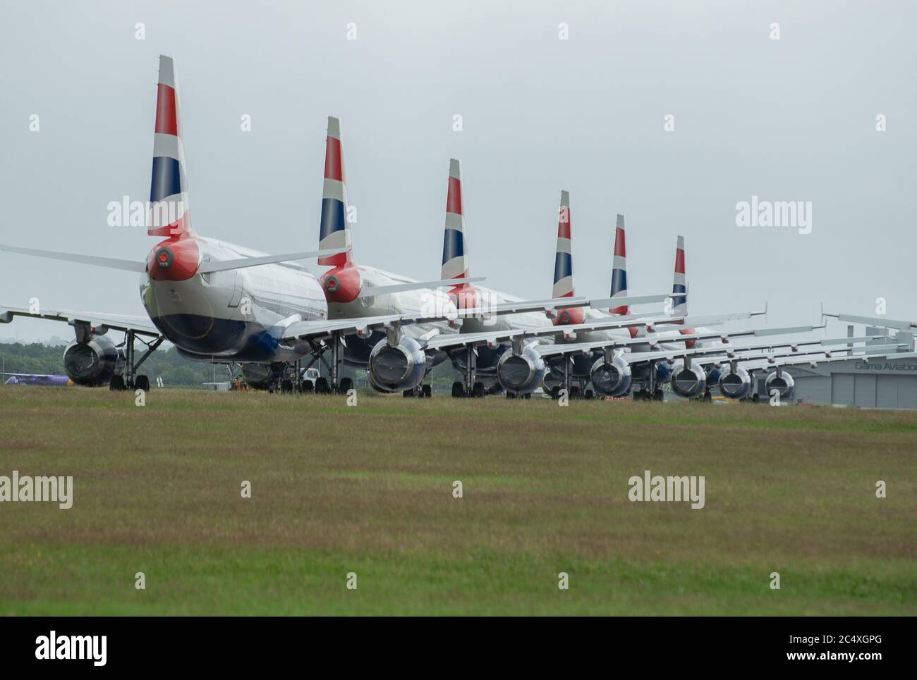 British Airways aircraft line up on the runway at Glasgow Airport ...