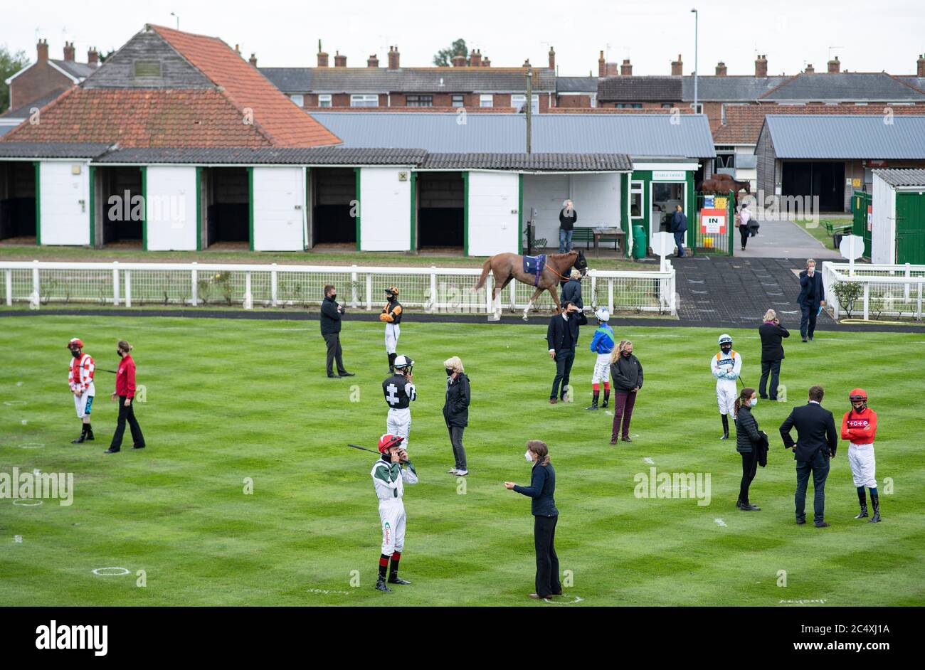 jockeys and connection in the paddock before the Download The At The ...
