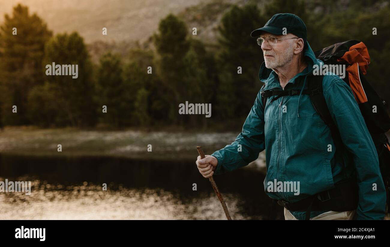 Old man walking alone sunset hi-res stock photography and images - Alamy