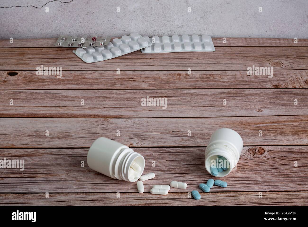 Home therapy. Two different bottles of different pills Stock Photo - Alamy