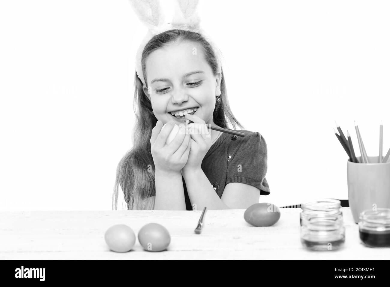 Smiling girl wearing on blouse Black and White Stock Photos & Images ...