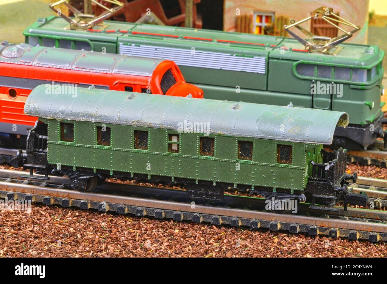 Close-up of model railway carriage on the rail tracks. Perfect model of ...