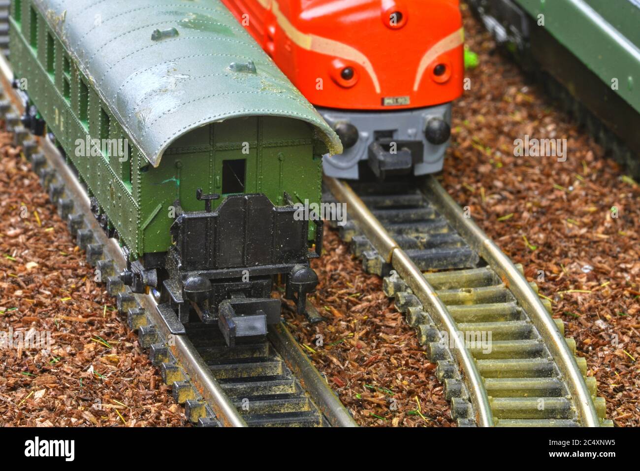 Close-up of model railway carriage on the rail tracks. Perfect model of ...