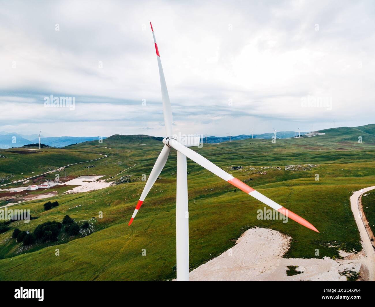 High wind generator on green meadows in Montenegro Stock Photo - Alamy