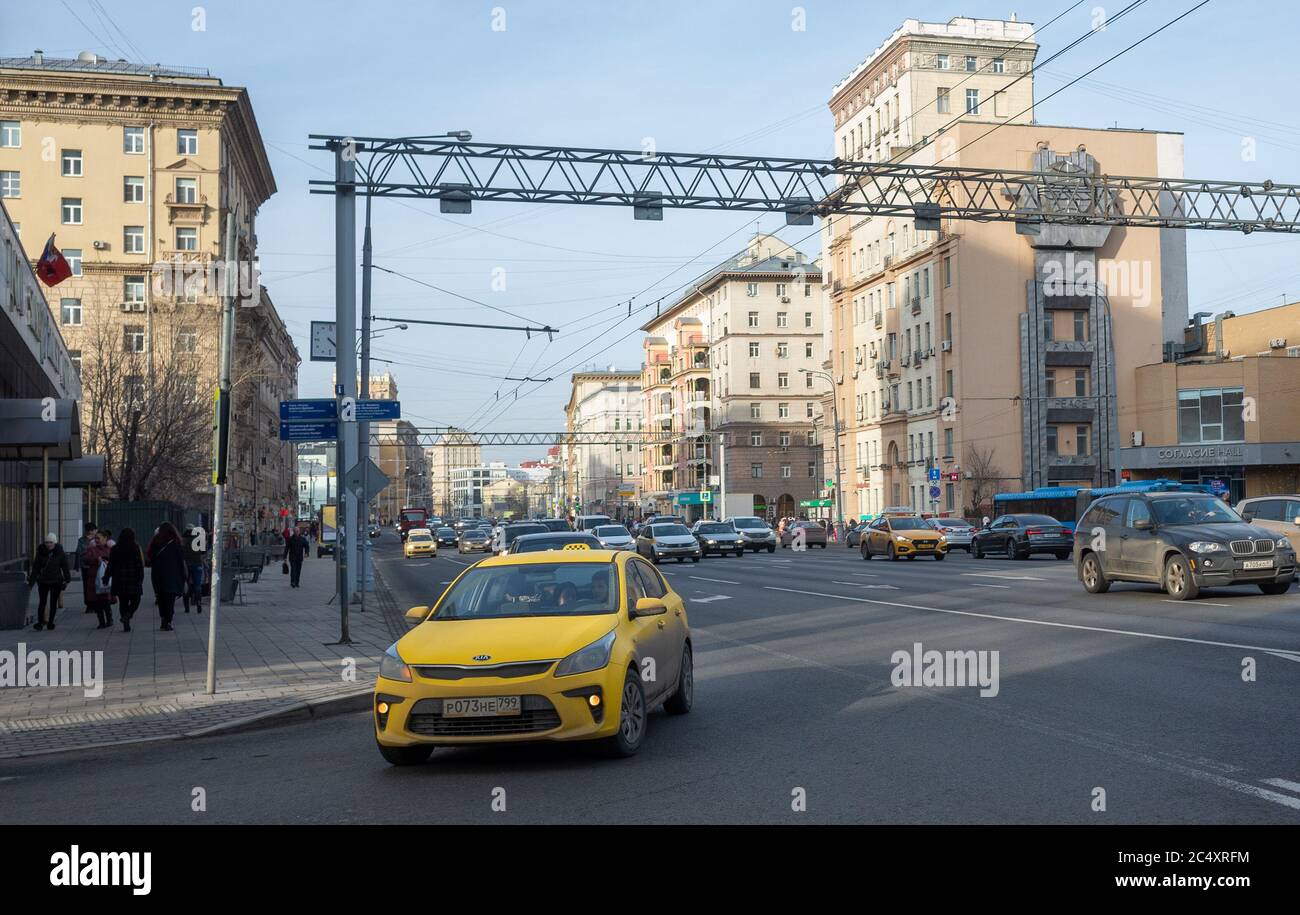 March 18, 2019, Moscow, Russia. Taxi service car a busy street during ...