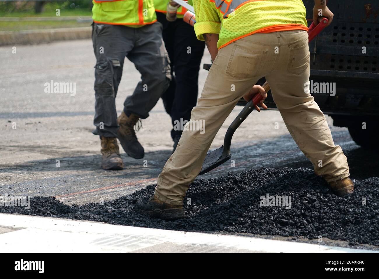 worker paving the road with asphalt Stock Photo - Alamy