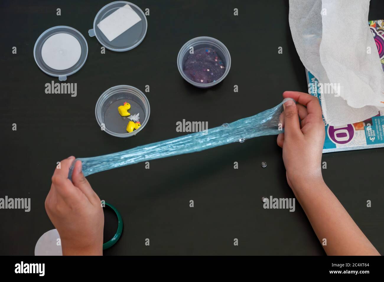 Child stretching slime hi-res stock photography and images - Alamy